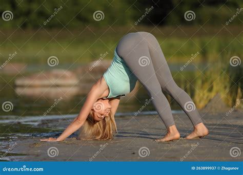 Young Naked Woman Practices Yoga On The Beach Stock Image Image Of