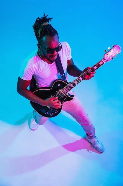Free Photo Young African American Musician Playing The Guitar Like A
