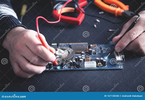 Man Checking Computer Motherboard With A Multimeter Stock Photo Image Of Component Checking