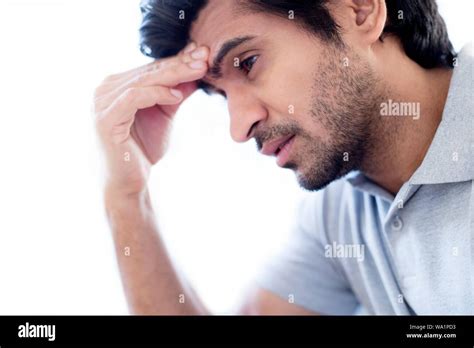 Stressed Man Holding Forehead Hi Res Stock Photography And Images Alamy