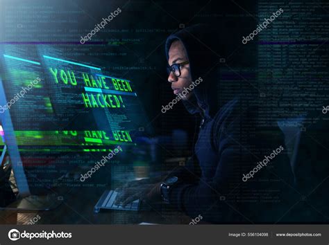 Cyber Warfare Cropped Shot Of A Young Man Hacking Into A Secure