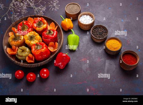 Top View Cooked Bell Peppers With Ground Meat And Seasonings On Grey