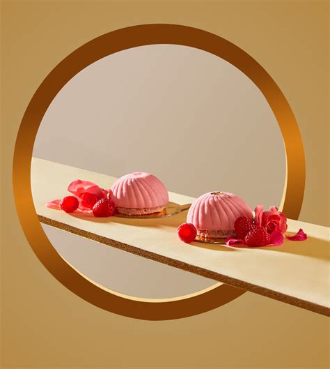 Delicious Desserts With Pink Icing And Raspberry Toppings