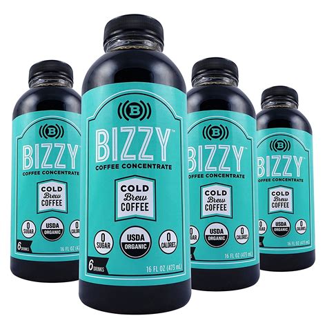 Four Bottles Of Bizzy Coffee Concentrate Sitting Next To Each Other
