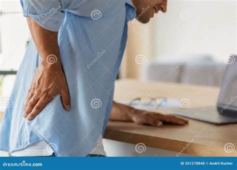 Man Feeling Severe Backache From Long Sedentary Work At The Computer In