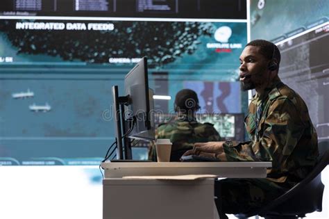 Military Intelligence Specialist Using Modern Satellite Systems And