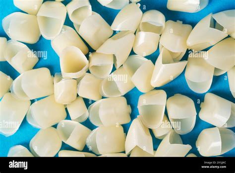 Background Of Many Dental Crowns Made Of Metal Ceramics And Zirconium