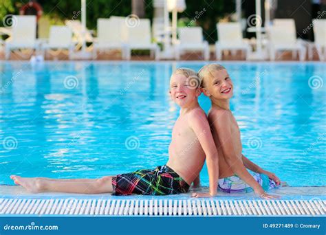 Two Brothers Enjoying Swimming Pool Stock Image Image Of Active