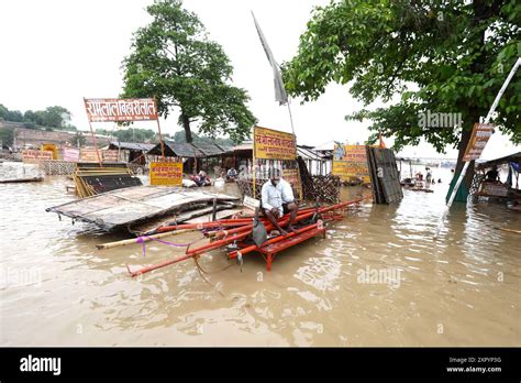 A Man Sit At Submerged Place At The Bank Of Sangam As Water Level Of