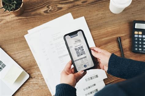 Premium Photo Paying Invoice Scanning Qr Code From Document Using Technology Qr Scanner On
