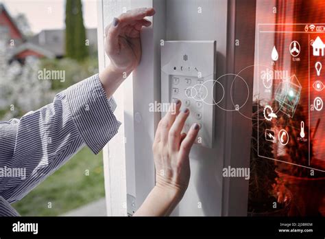 Woman Using Entry Door Keypad Stock Photo Alamy