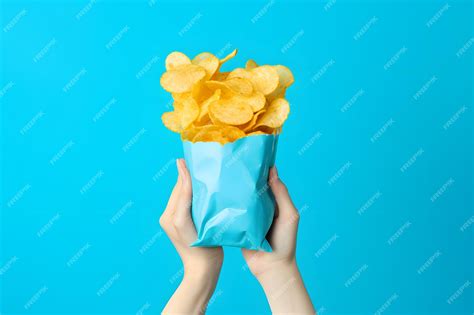 Snack Fiesta Crunchy Chips Spilling From Cylinder Tube Wrapper Premium Ai Generated Image