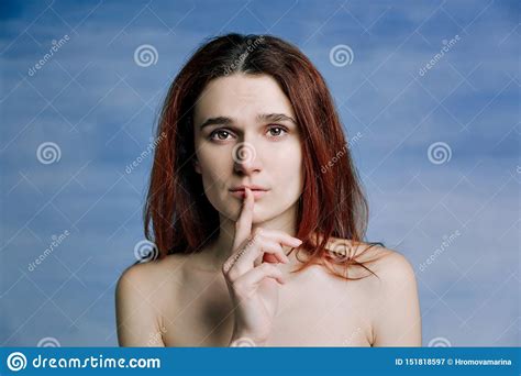 A Young Girl With Bare Shoulders Pressed Her Finger To His Lips In