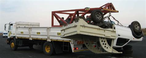 Set Up For Dynamic Rollover Testing Test Vehicle Suspended From Rigid