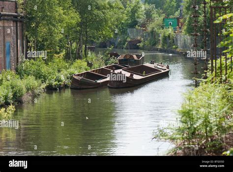 Old Canal Barges Partially Submerged In The Birmingham To Wolverhampton
