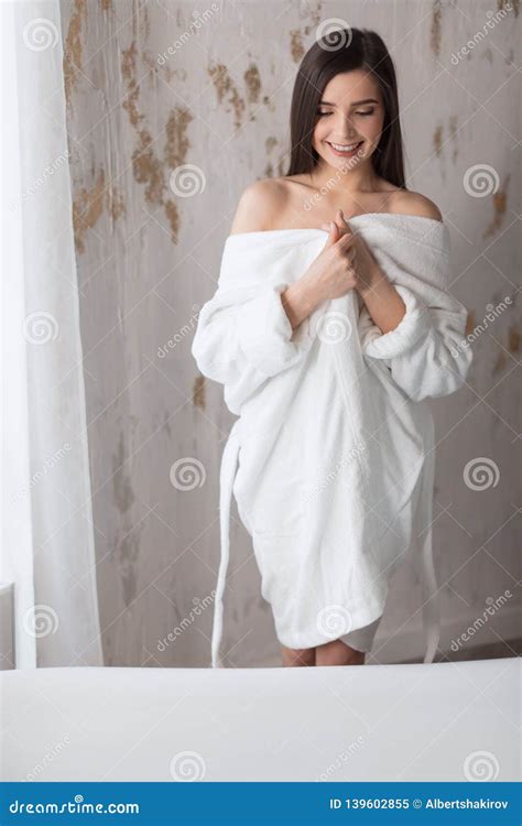 Beautiful Young Lady In Bath Robe Going To Take A Bath In White