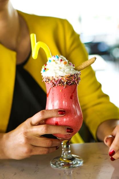 Premium Photo Glass Of Raspberry Milkshake With Whipped Cream And