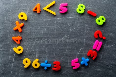 Simple Math Exercises Lying On Surface Of Clean Blackboard Stock Image