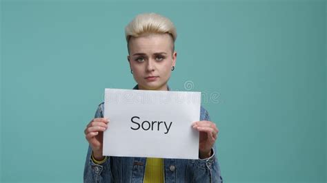Cheerful Positive Lady With A Guilty Facial Expression Within Colorful