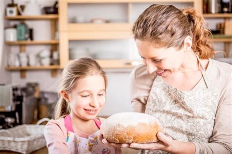 Premium Photo Mother And Daughter Baking Bread In Kitchen Together
