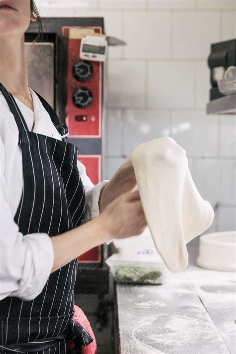 Young Chef Prepares Fresh Dough For Pizza By Stocksy Contributor