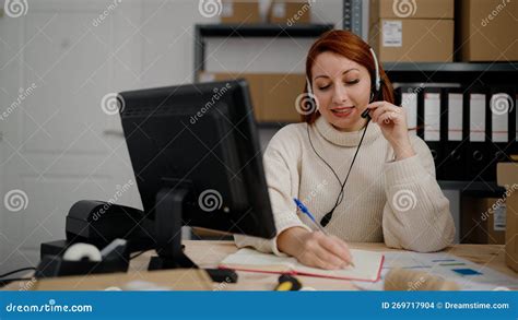 Young Redhead Woman Ecommerce Call Center Agent Having Video Call At