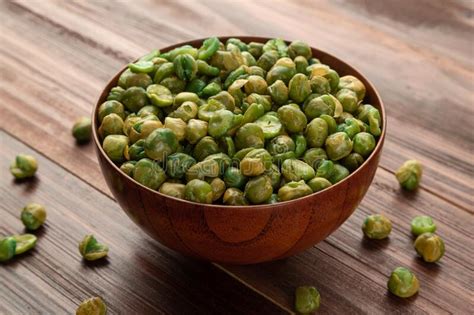 Salted Green Peas In Wooden Bowl On The Table Healthy Snack