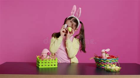 Enthusiastic Young Girl Playing Peek A Boo In Front Of Camera Stock