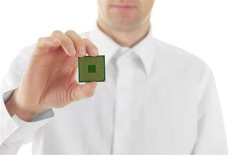 Premium Photo Man Holding Microprocessor In His Hand On White Background