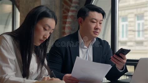 Two Business Managers Coworkers Asian Colleagues Work Together Teamwork