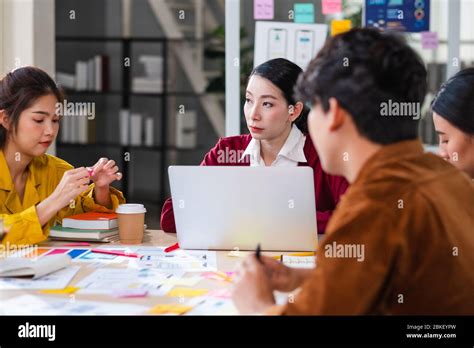 Ux Developer And Ui Designer Brainstorming About Mobile App Interface Wireframe Design On