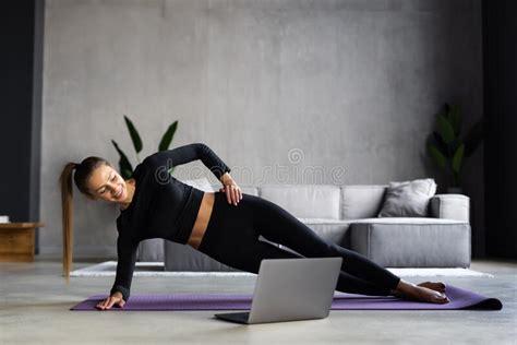 Beautiful Sporty Cheerful Woman Is Doing Side Plank Exercise Watching