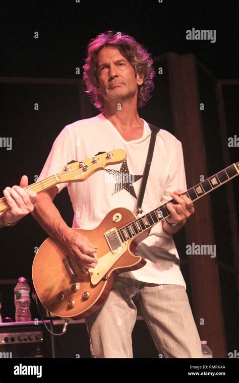 Musician Billy Squier Is Shown Performing On Stage During A Live Concert Appearance Stock