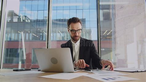 Concentrated Businessman Trader Are Tired The Man Takes Off His Glasses And Rubs His Tired Eyes