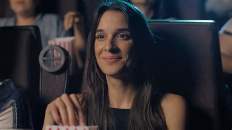 Woman Joyfully Laughing In A Theater Seat Free Stock Video