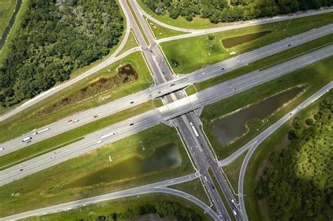Premium Photo Aerial View Of Freeway Overpass Junction With Fast Moving Traffic Cars And