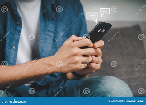 Young Asian Man Using Smartphone Typing Chatting Conversation With Pop Up Chat Box Icons