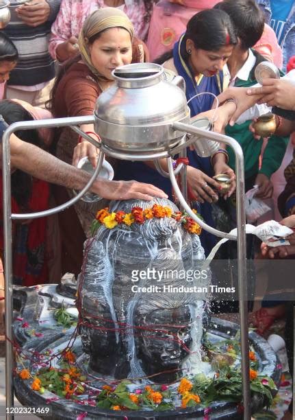 Devotees Perform Abhishek Of Lord Shiva On Maha Shivaratri Photos And