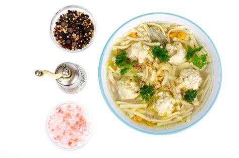 Premium Photo Chicken Broth With Egg Noodles And Meatballs