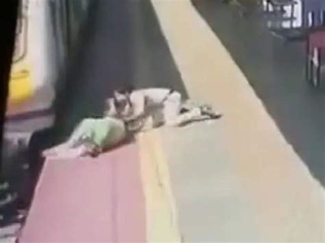 Watch Video Rpf Constable Saves Life Of Woman Who Slipped While