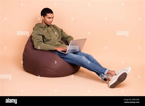 Full Length Photo Of Intelligent Focused Man Use Macbook Typing Codding