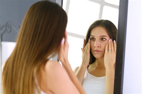 Premium Photo Young Woman Looking Herself Reflection In Mirror At Home