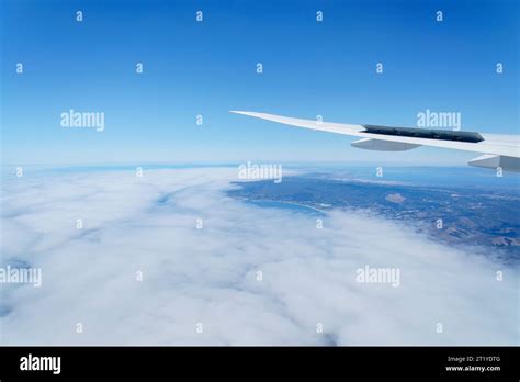 Aerial View Of Beautiful Clouds Covering The Landscape Airplane Flying