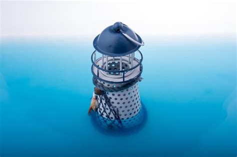 Premium Photo Little Model Lighthouse In Water