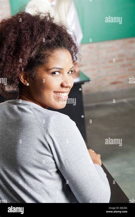 Beautiful Woman Smiling In Classroom Stock Photo Alamy