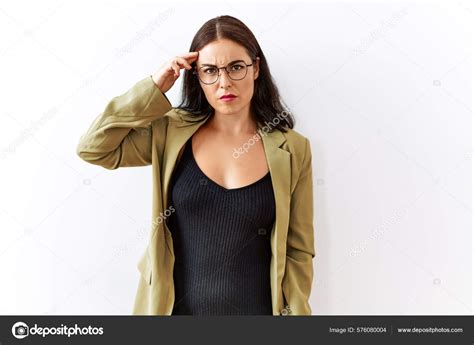 Young Brunette Woman Standing Isolated Background Pointing Unhappy