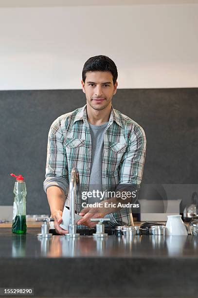 Men Doing Dishes Photos And Premium High Res Pictures Getty Images