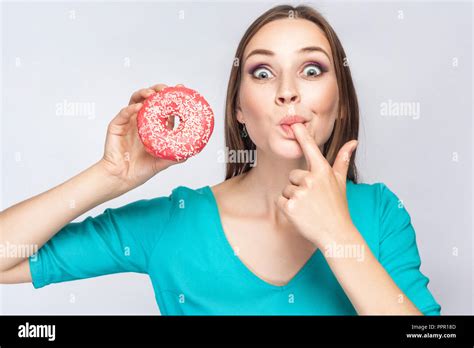 Portrait Of Crazy Young Beautiful Girl In Blue Blouse Standing Holding