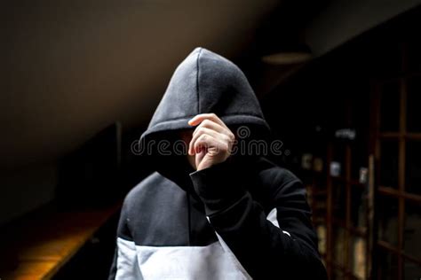 Anonymous Man In The Dark Hood Standing In The Mysterious Pose F Stock