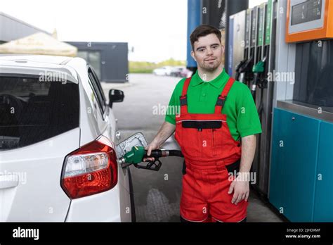 Down Syndrome Man Employee Fueling Car At Gas Station Stock Photo Alamy